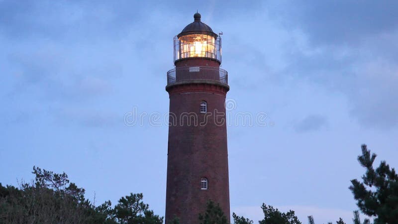 Shinning Old Lighthouse with Dark Clouds after Sunset in Background ...