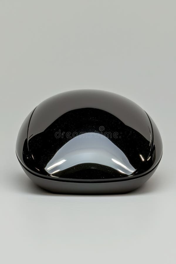 A Shiny Black Pebble-like Object on a Neutral Background. Stock ...