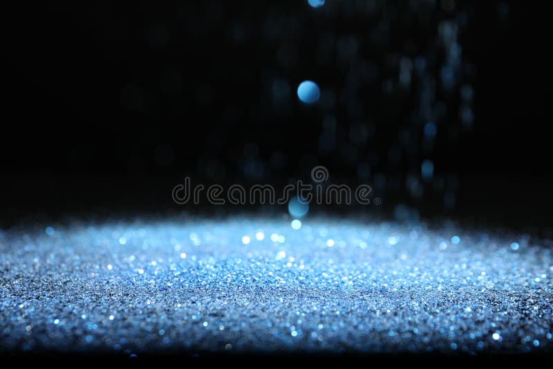 Shiny Blue Glitter Falling Down on Black Background. Bokeh Effect Stock ...