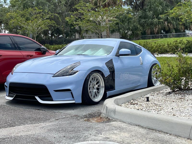 Shiny Blue Modern Vehicle Parked in a Parking Lot Stock Image - Image ...
