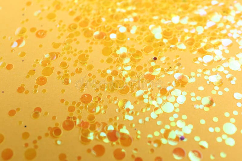 Shiny Bright Golden Glitter on Yellow Background Stock Image - Image of ...