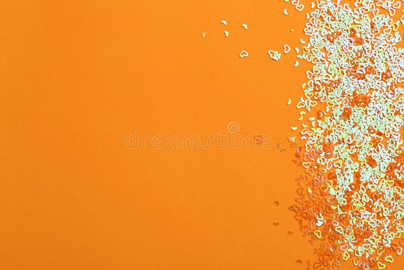Shiny Bright Heart Shaped Glitter on Orange Background, Top View. Space ...