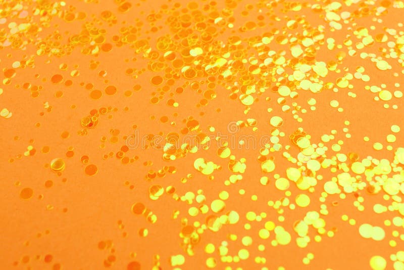 Shiny Bright Yellow Glitter on Pale Coral Background Stock Photo ...