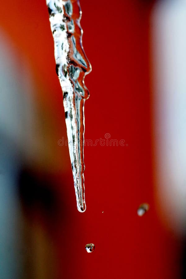 Shiny Clear Ice Icicles Hang on a Clear Day. Stock Photo - Image of ...