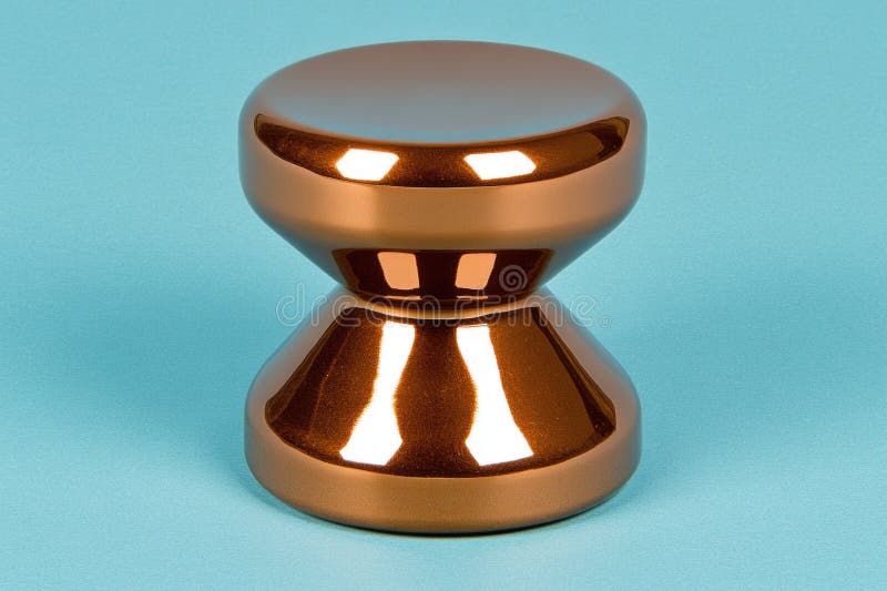 Shiny Copper Hourglass-shaped Object on Light Blue Background Stock ...