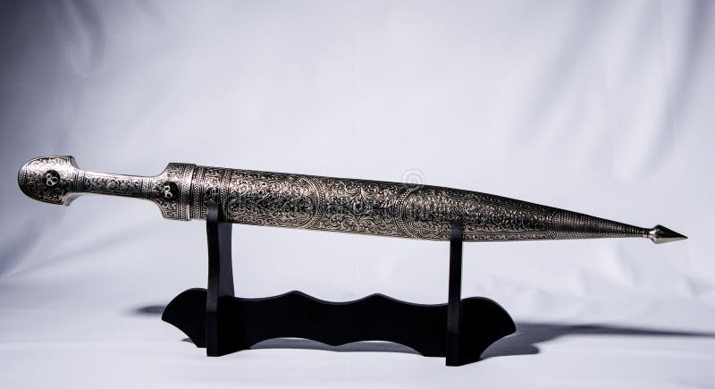 Shiny dagger in sheath stock image. Image of engraving - 132324425