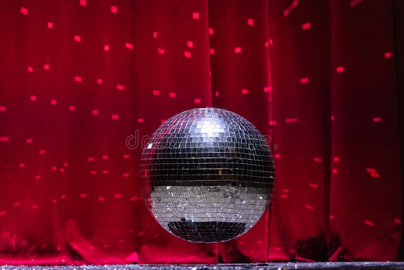 Shiny Disco Ball on a Stage with Red Curtain Stock Image - Image of ...