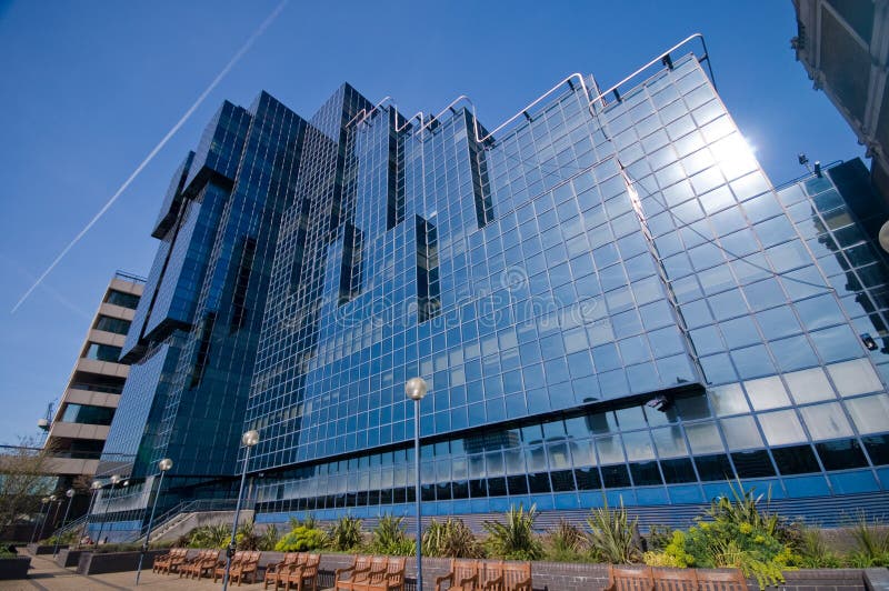 Shiny Glass Office Building Against Blue Sky Stock Photo - Image of ...