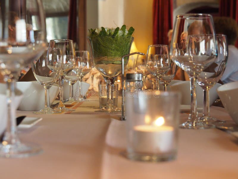 Shiny Glasses and Service on a Dinner Table at a Restaurant Editorial ...