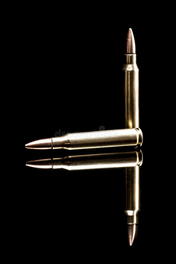 Shiny Gold Bullets stock image. Image of isolated, brass - 69777211