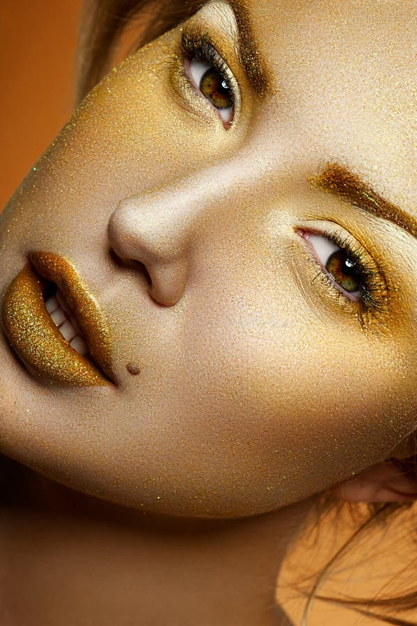 Shiny Gold on Face of Beautiful Women Stock Photo - Image of golden ...