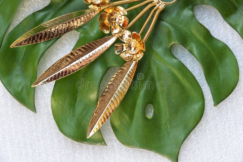 Shiny Gold Flower on Green Leaf Stock Photo - Image of orient ...