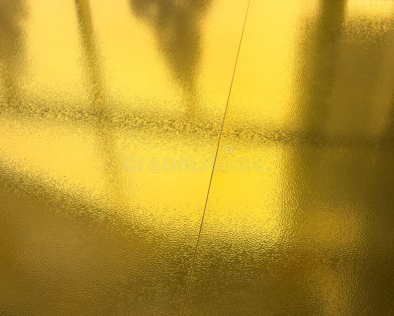 A Shiny Gold Surface with a Reflection of a Tree Stock Photo - Image of ...