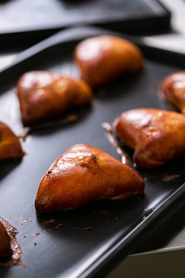 Shiny Golden Pies in Triangle Shape on Pan Stock Image - Image of ...