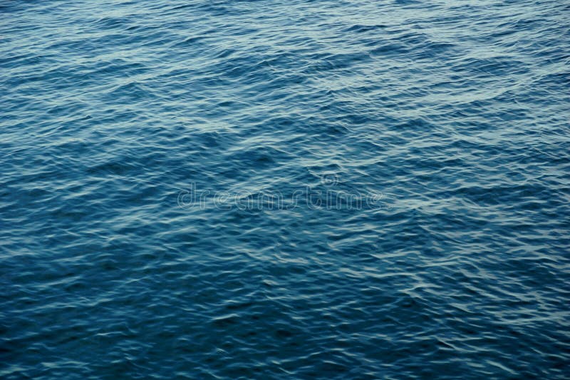 Shiny Gradient Blue Sea Surface with Small Waves and Light Reflection ...