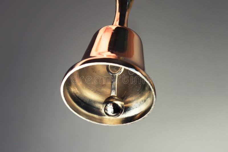Shiny metal bell ringing stock photo. Image of rays, shine - 66570678