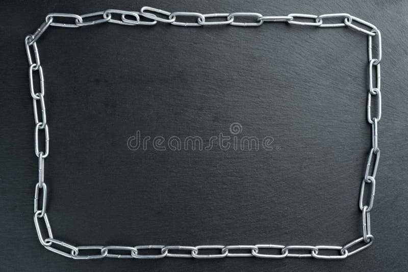 Shiny Metal Chain on a Dark Stone Slate Plate Background Stock Photo ...