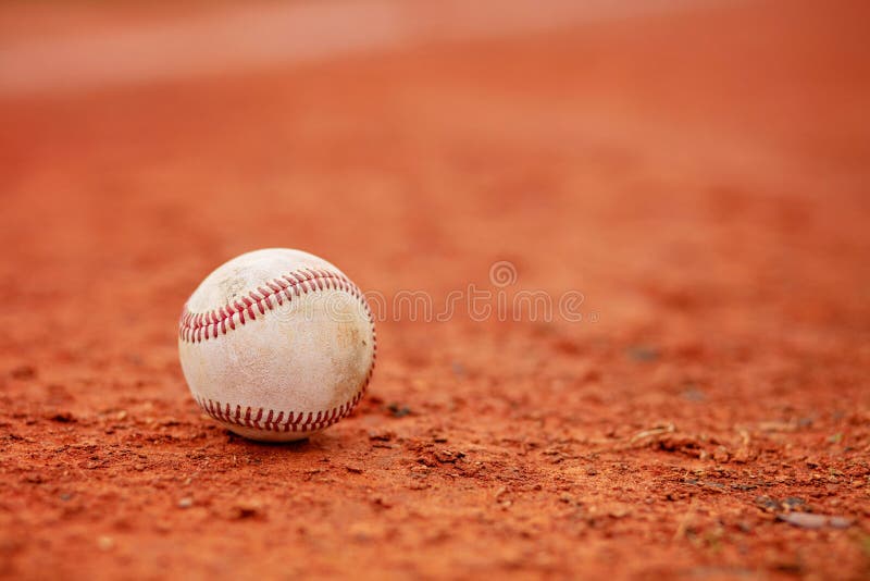 White Baseball Lying in Clay Stock Photo - Image of outdoors, baseball ...