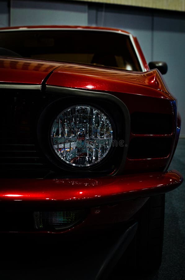 This Car is Shiny and Red, with Its Lights on Stock Image - Image of ...