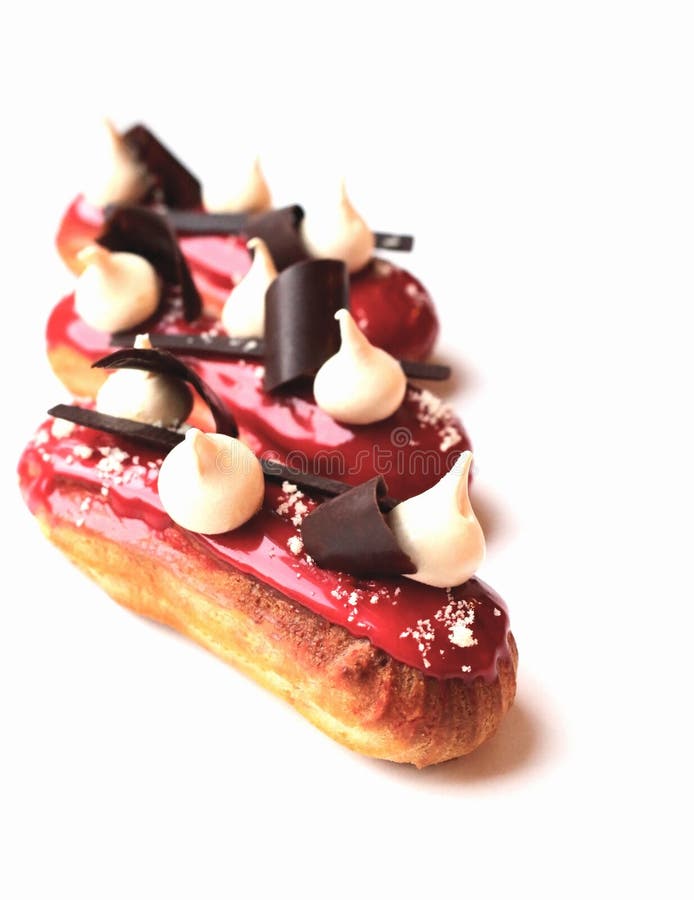 Shiny Red Glazed Raspberry Eclairs with Meringues and Chocolate ...