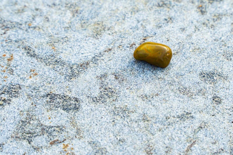 Shiny Rock on Textured Concrete Surface Stock Photo - Image of abstract ...