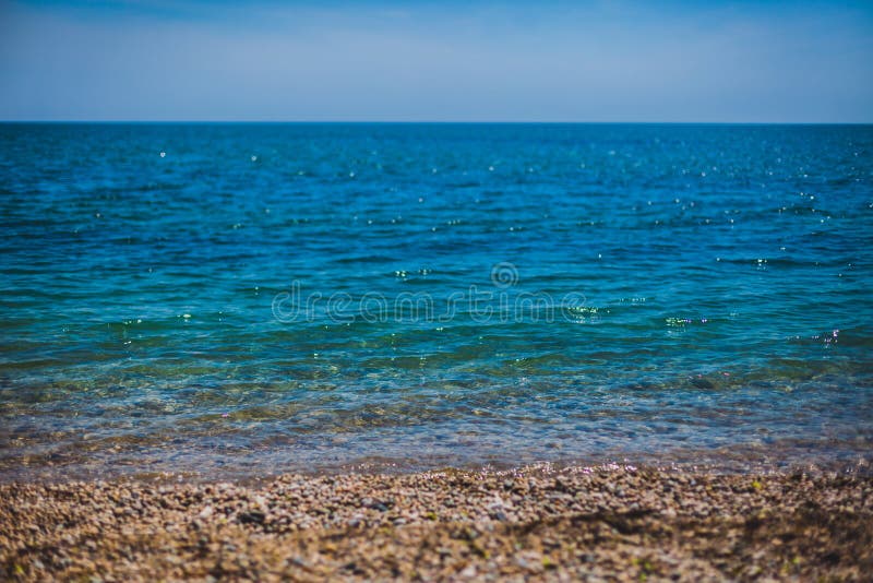 Shiny Sea Coast with Shingle Stock Image - Image of outdoors, blue ...