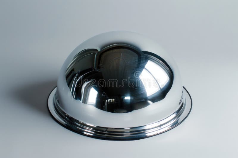 A Shiny Silver Bell Sitting on a White Surface Stock Photo - Image of ...