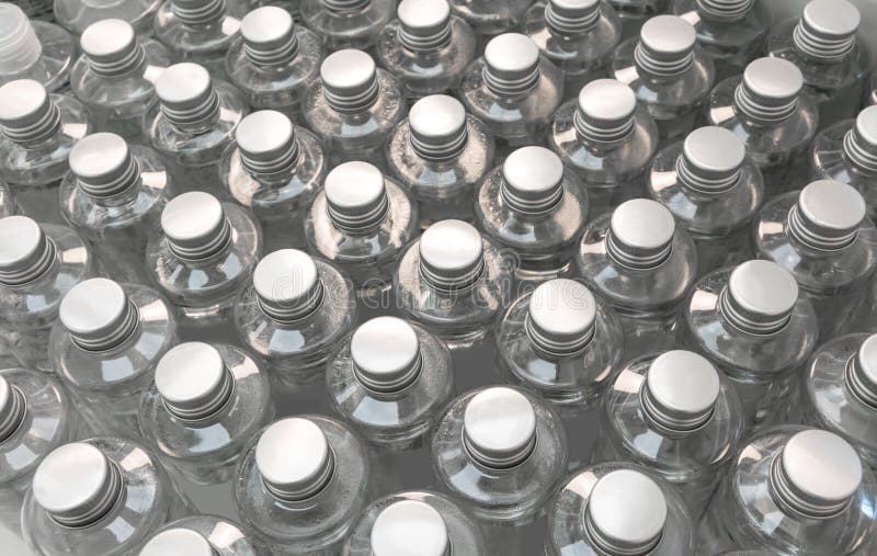 Shiny Silver Caps of Clear Plastic Bottles in Rows for Pattern B Stock ...