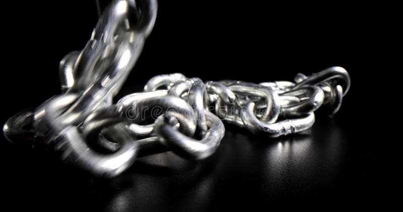Shiny Silver Chain Falls Down on Table Leaving Reflection Stock Video ...