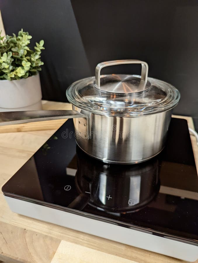 Shiny Silver Pot with Closed Lid on the Stove Stock Photo - Image of ...