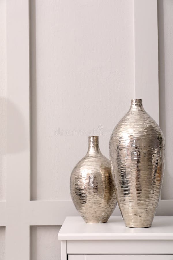 Shiny Vases on White Table Indoors. Interior Element Stock Image ...