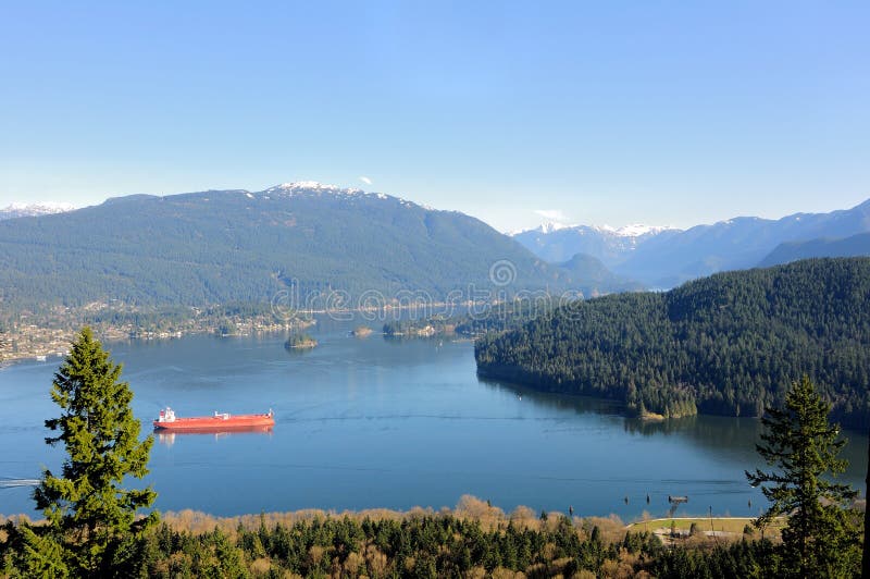 Ship Anchoring in a Sea Inlet Stock Image - Image of blue, island: 30440577