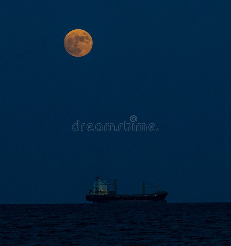 Ship on the Atlantic Ocean with the Full Moon in the Sky in the Evening ...