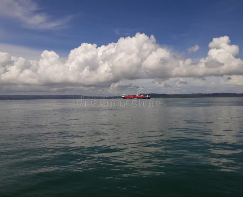 A Ship on the Blue Ocean and White Sky Stock Image - Image of horizon ...