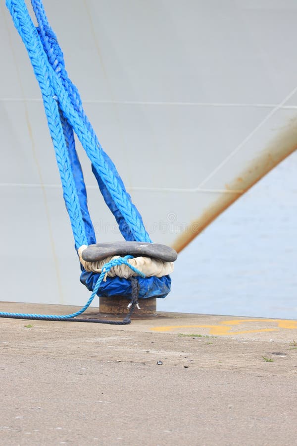 Ship bollard and blue rope stock photo. Image of ship - 223996386