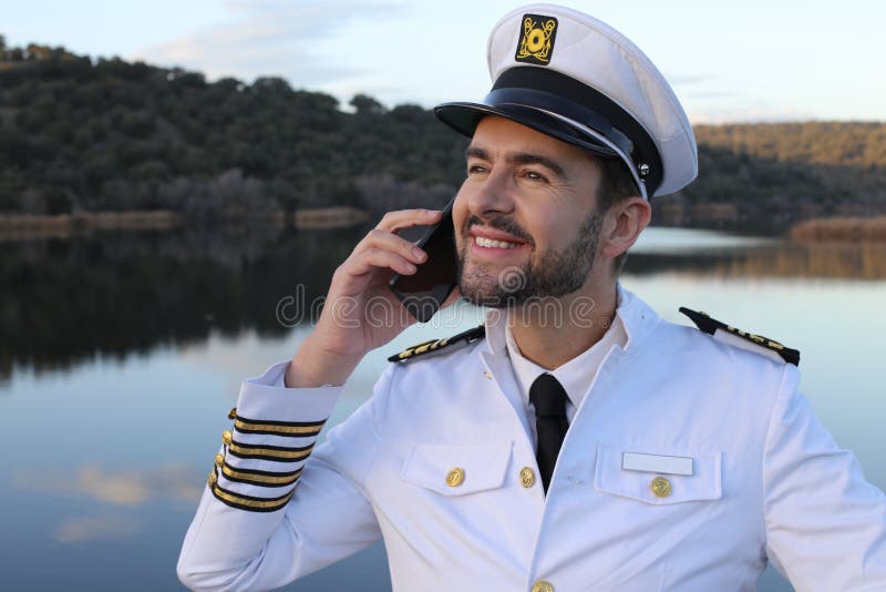 Ship Captain Making a Phone Call Stock Image - Image of clothing, ocean ...