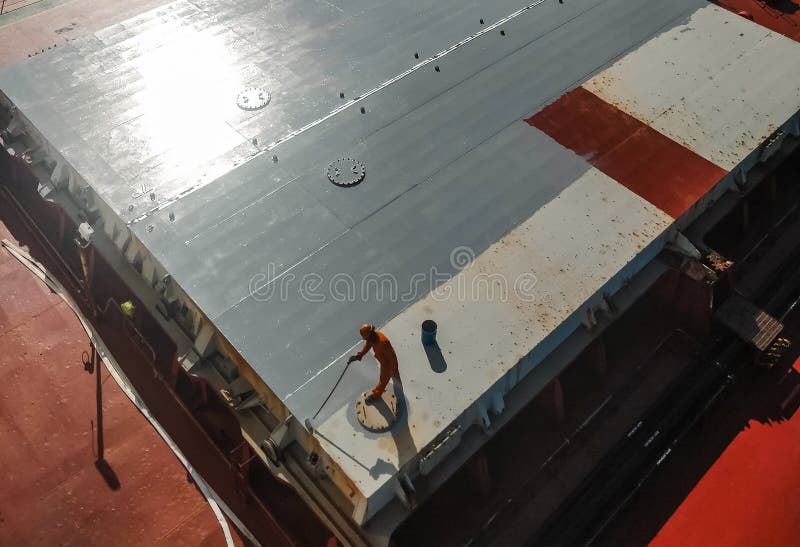 A Ship Crew Painting the Hatch of the Bulk Carrier Ship during Voyage ...