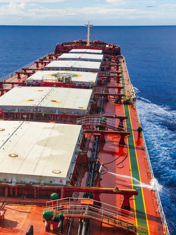 Ship Crew Washing and Cleaning the Ship Deck after Loading Operation ...