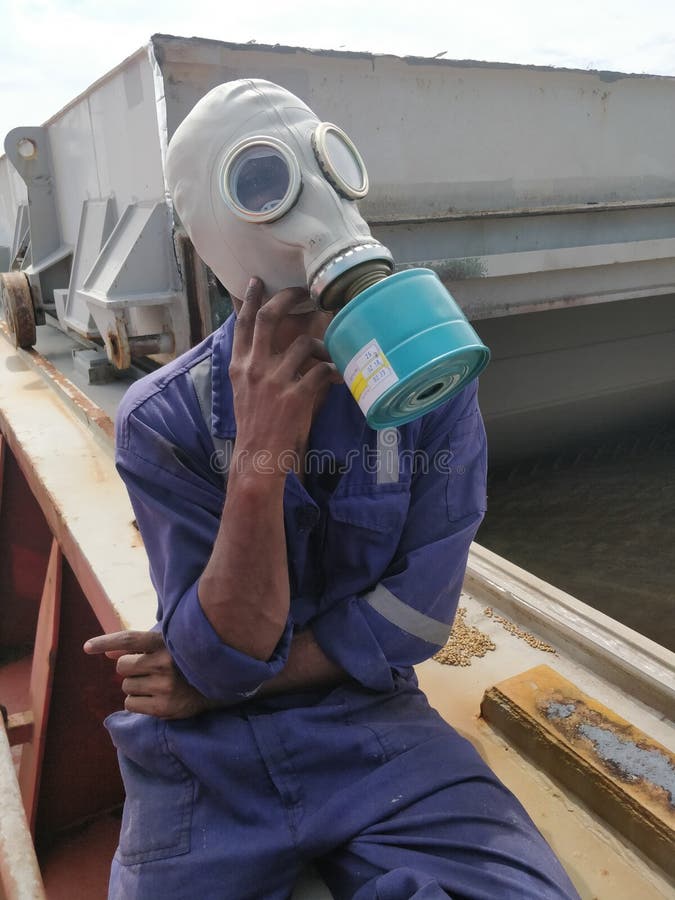 Ship Crew Wearing Oxygen Mask and Preparing for Entering the Hatch for ...