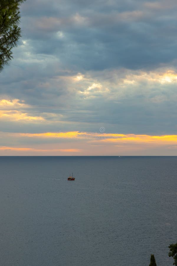 Ship in the Distance at Sunset Stock Photo - Image of shipping, dusk ...