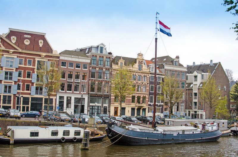 The Ship with Dutch Flag on the Canal in Amsterdam, Netherlands, Europe ...