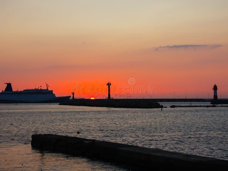 The Ship Enters the Sea Bay Against the Backdrop of the Setting Sun ...