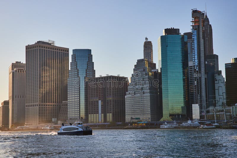 Ship Going Down River in New York City with Skyline in Background ...
