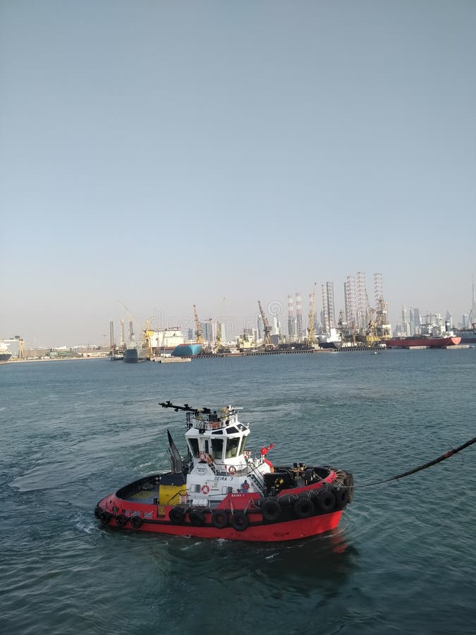Ship Handling Tug Pulling Out Shop from Dock Stock Image - Image of ...
