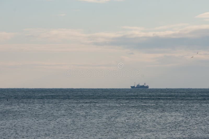 A ship on horizon. stock photo. Image of trawl, trawler - 86698548