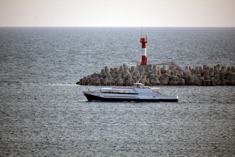 A ship and the lighthouse stock photo. Image of detail - 46283446