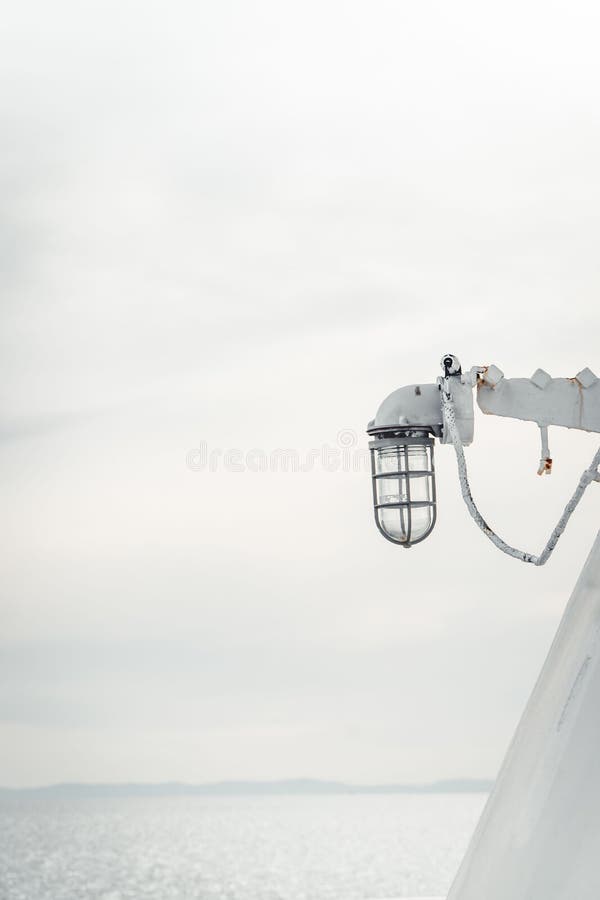 Ship Lighting on White Ferry Boat in the Ocean with White Clouds in the ...