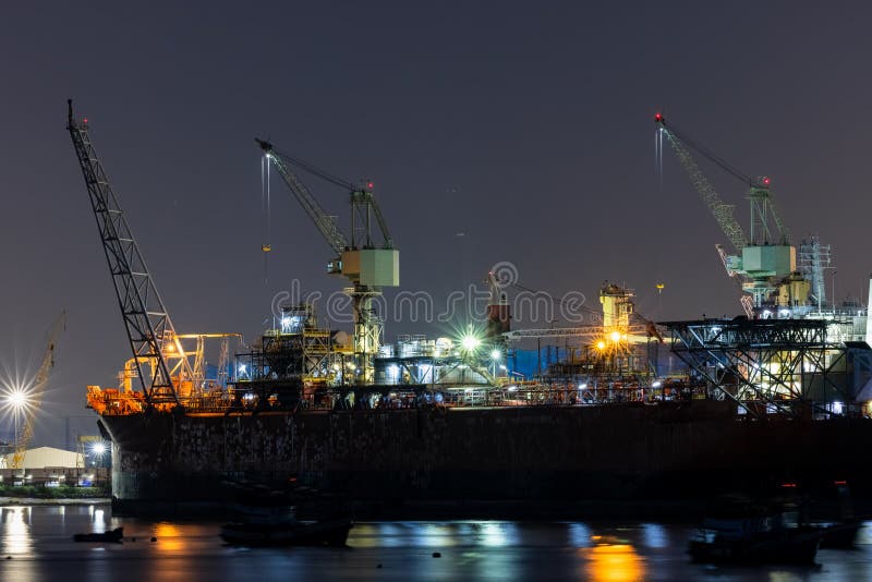 Ship Maintenance in Dry Dock at Night Stock Photo - Image of gantry ...