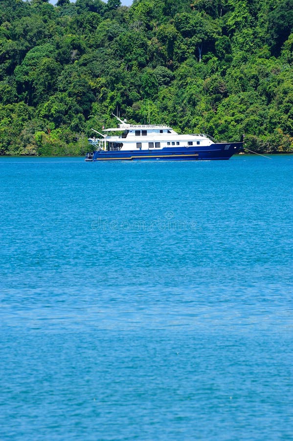 A ship next to an island stock image. Image of landscape - 19910187