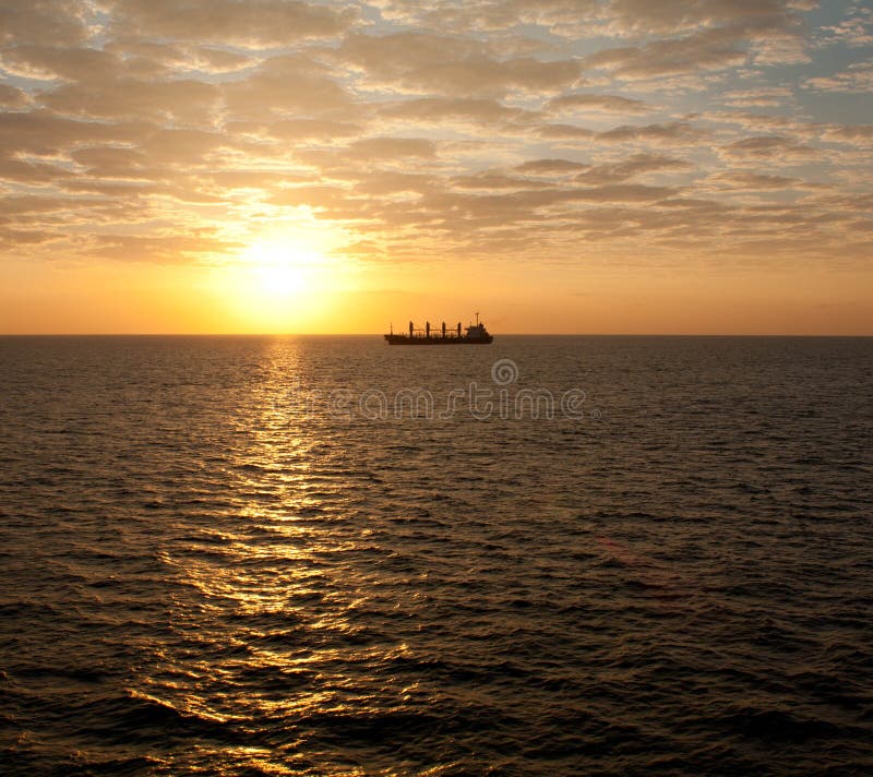 Ship on ocean at sunset stock photo. Image of marine - 19505026